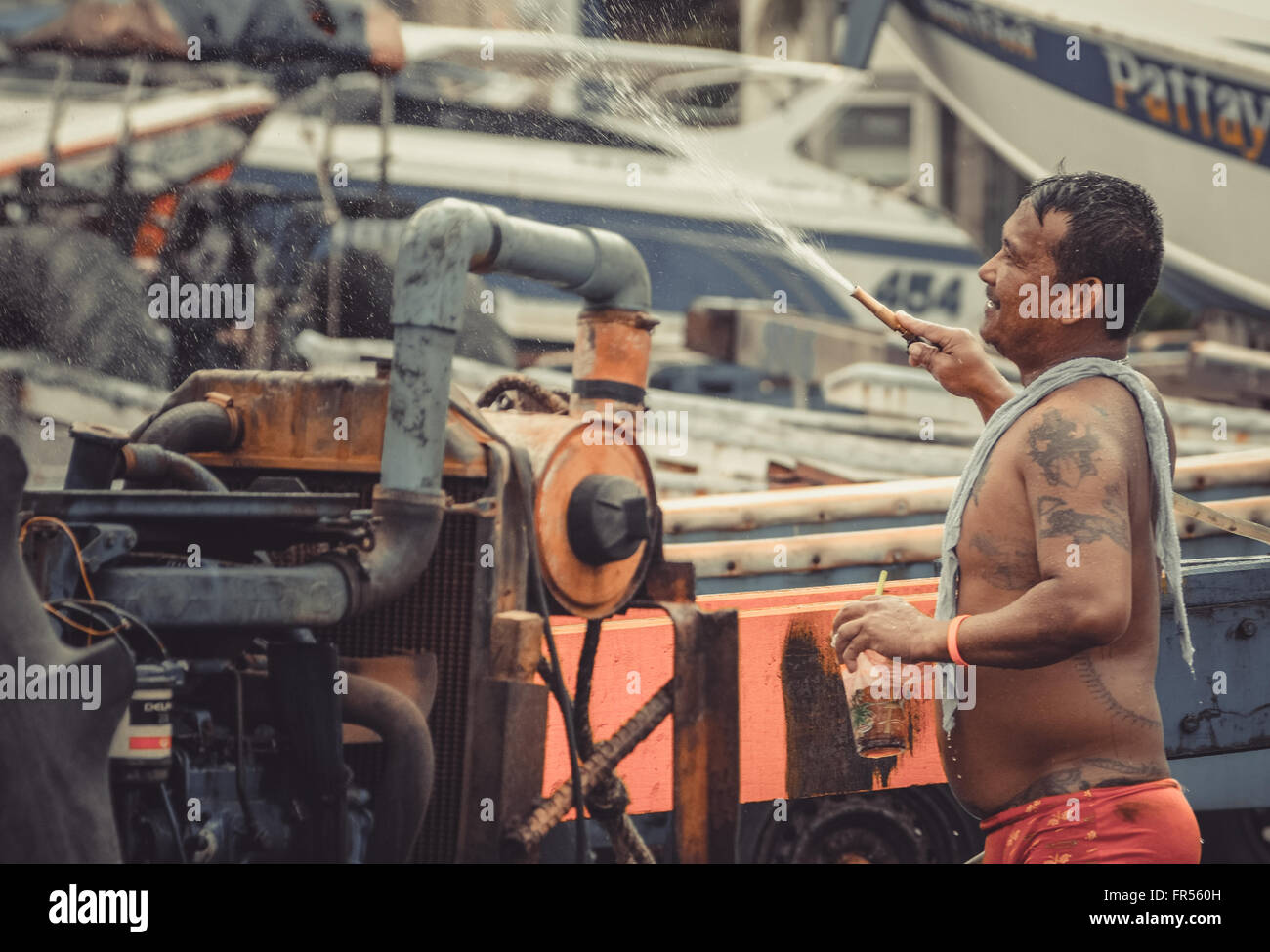 Local boat yard workers - Bali Hai pier area Stock Photo - Alamy