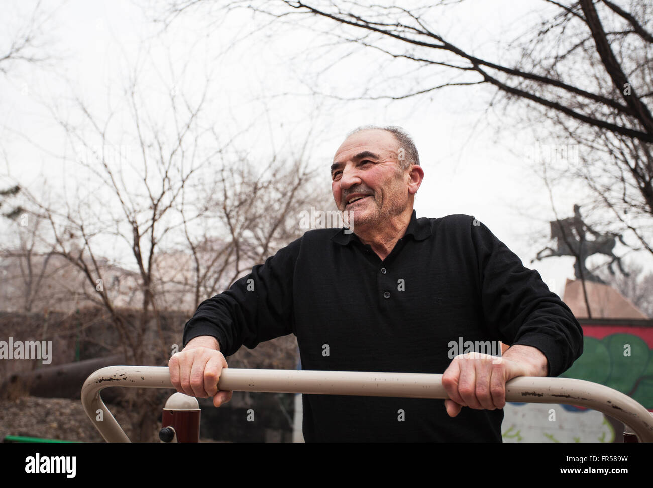 An old armenian man doing his morning trainings in the park in Yerevan ...