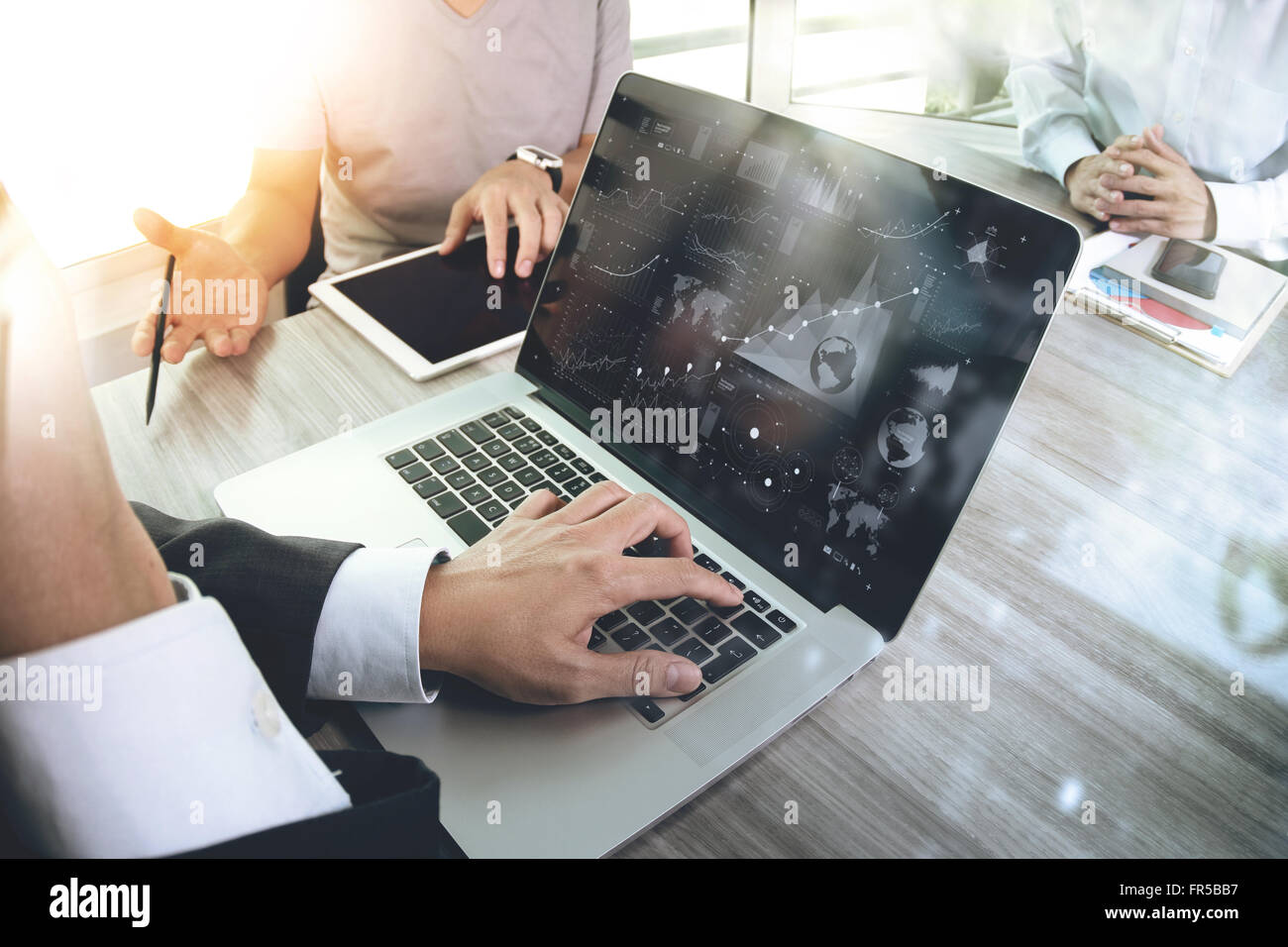 business documents on office table with smart phone and laptop computer ...