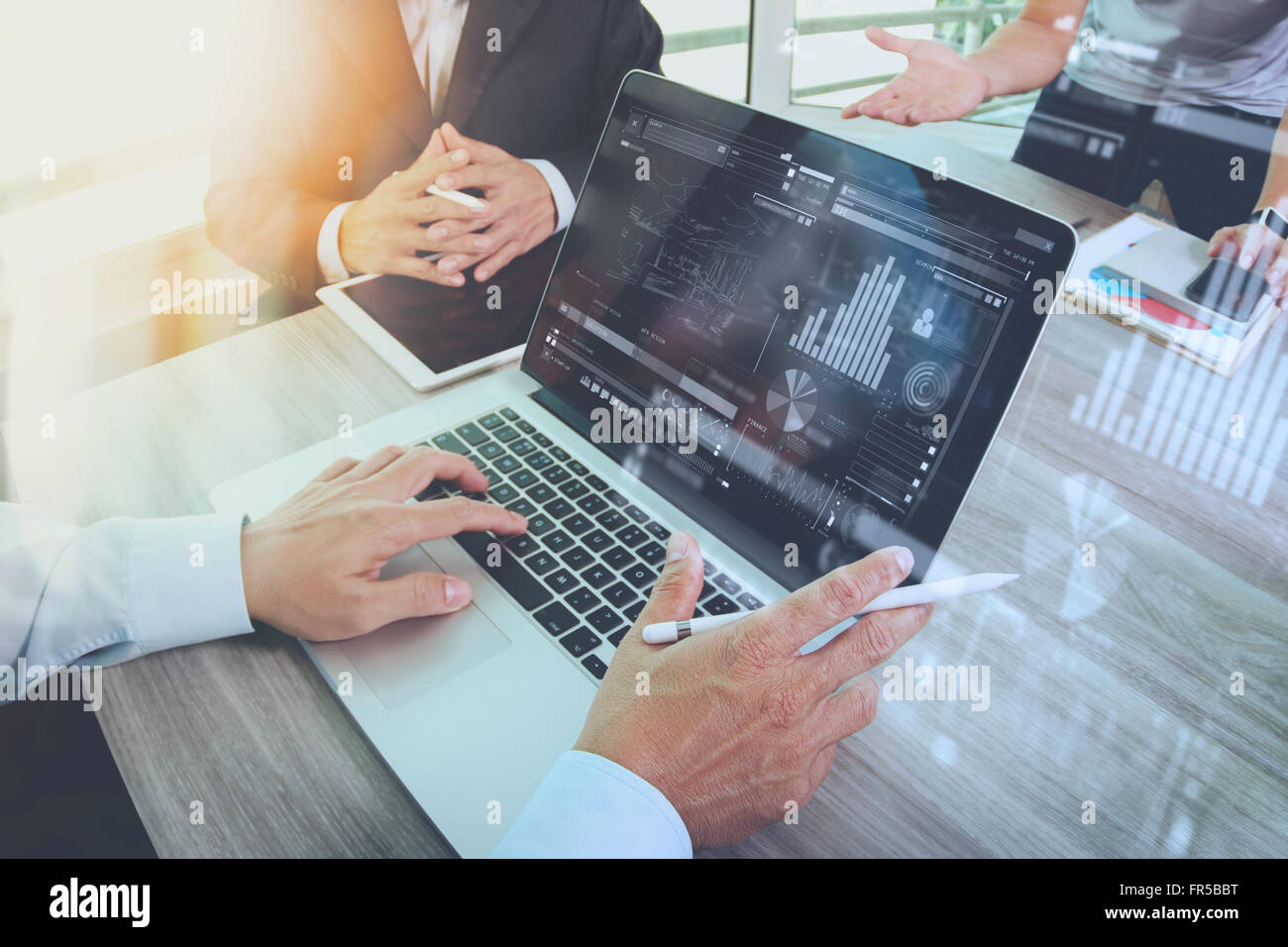 business documents on office table with smart phone and laptop computer ...