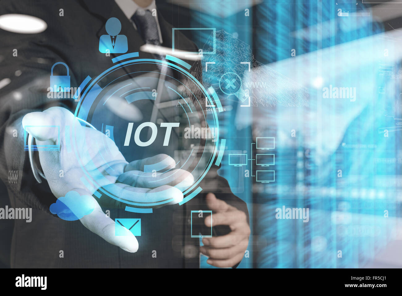 double exposure of hand showing Internet of things (IoT) word diagram ...