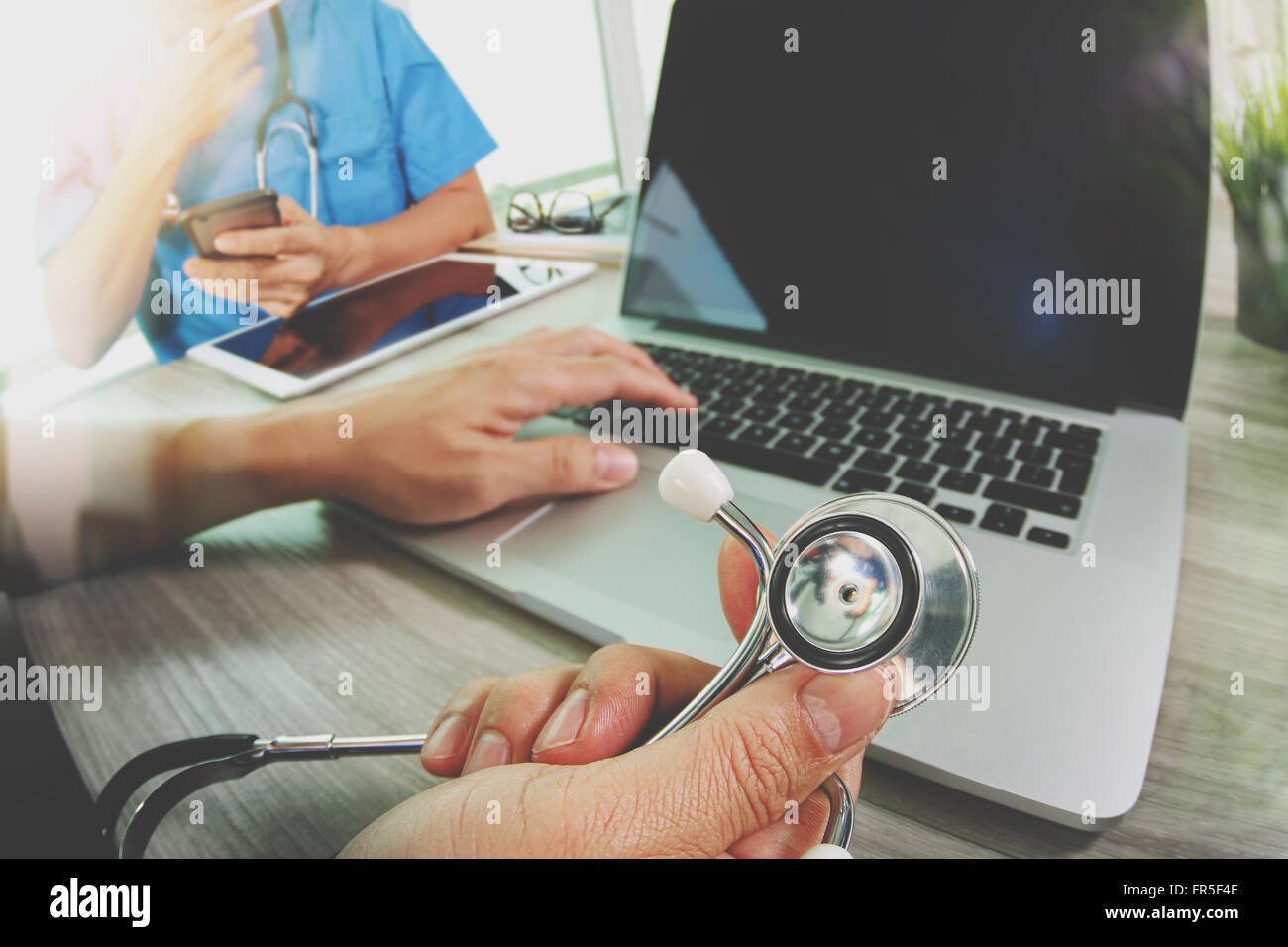 Medicine doctor hand working with modern computer and digital pro ...
