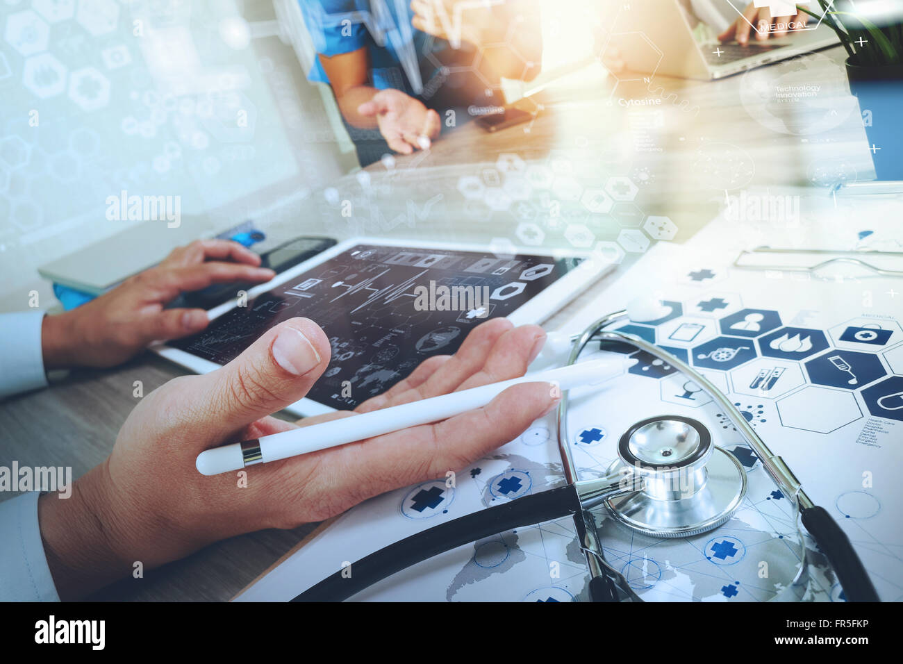 Medicine doctor hand working with modern computer and digital pro ...