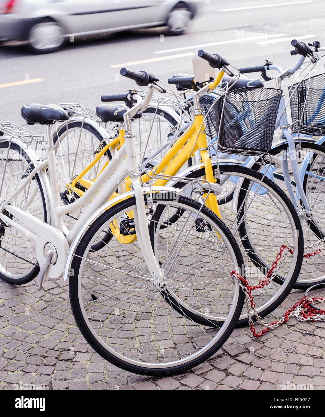 Parked bicycles on the sidewalk, chained together Stock Photo - Alamy