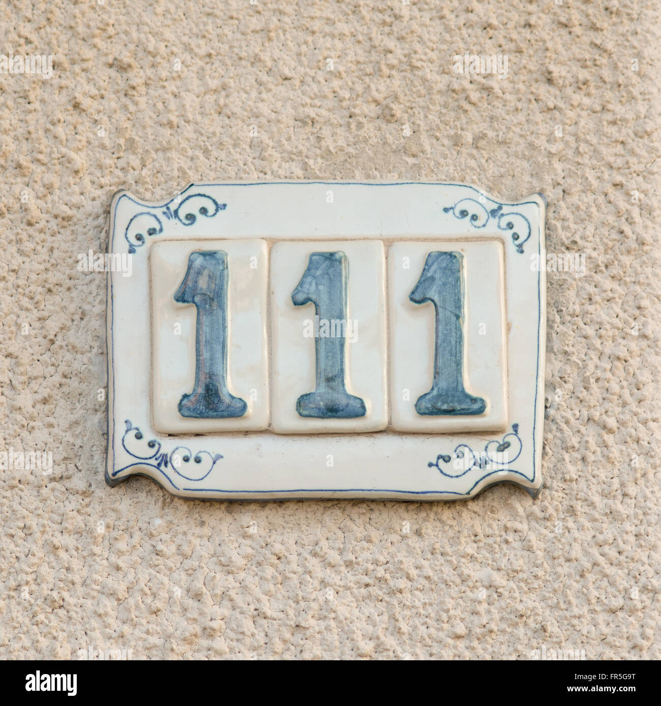 House number 111 tiles on wall Stock Photo - Alamy