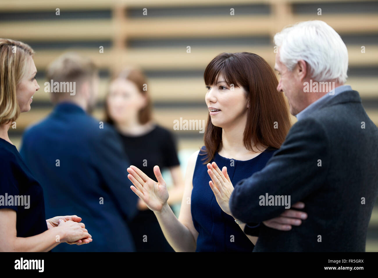 Talking to colleagues hi-res stock photography and images - Alamy