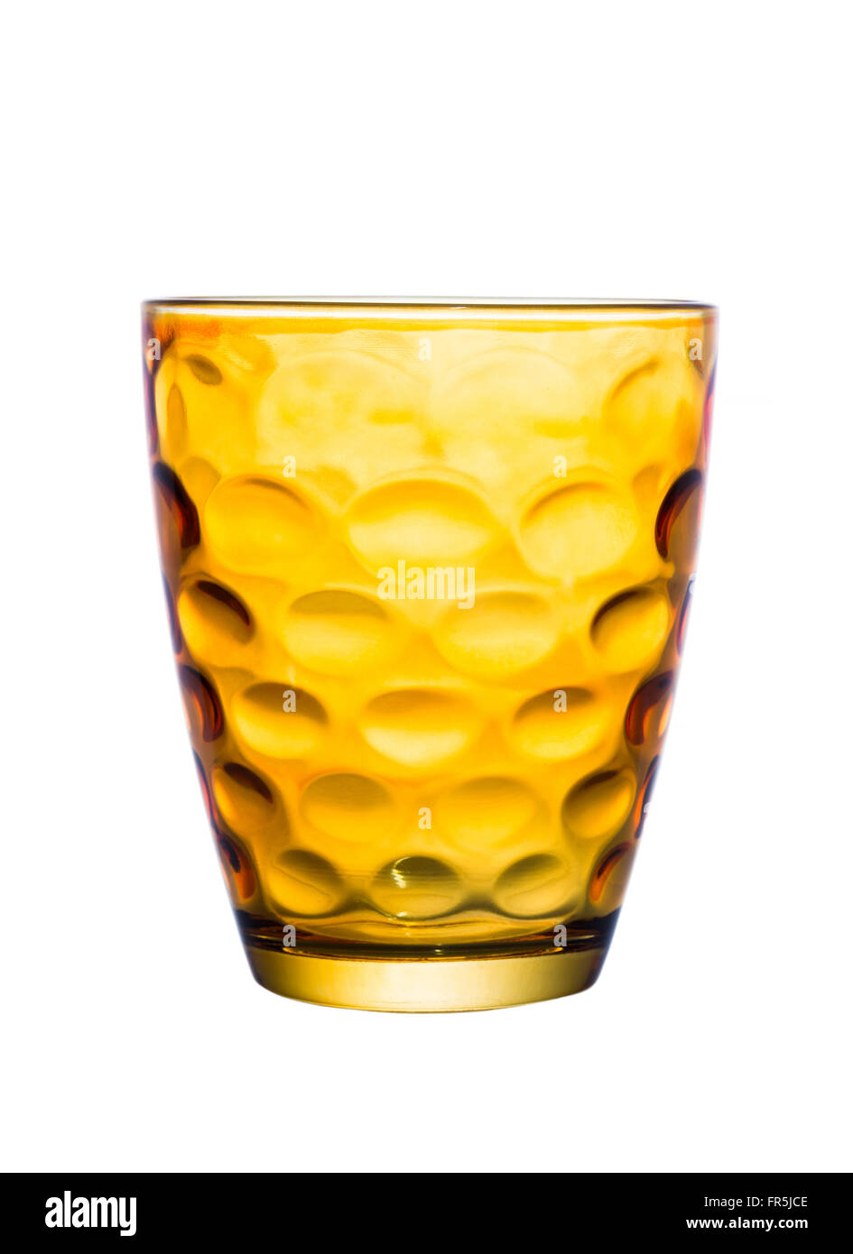Yellow glass with a pattern on a white background Stock Photo - Alamy