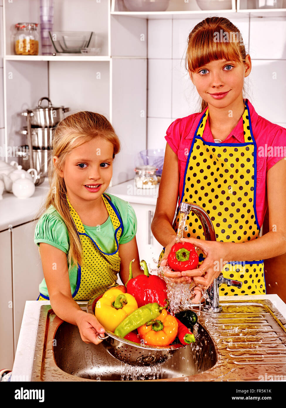 Children washing fruit at kitchen Stock Photo - Alamy