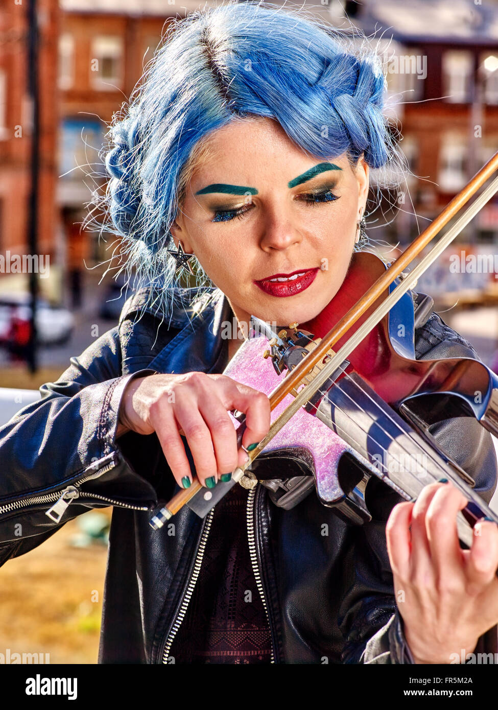 Music street performers with girl violinist Stock Photo - Alamy