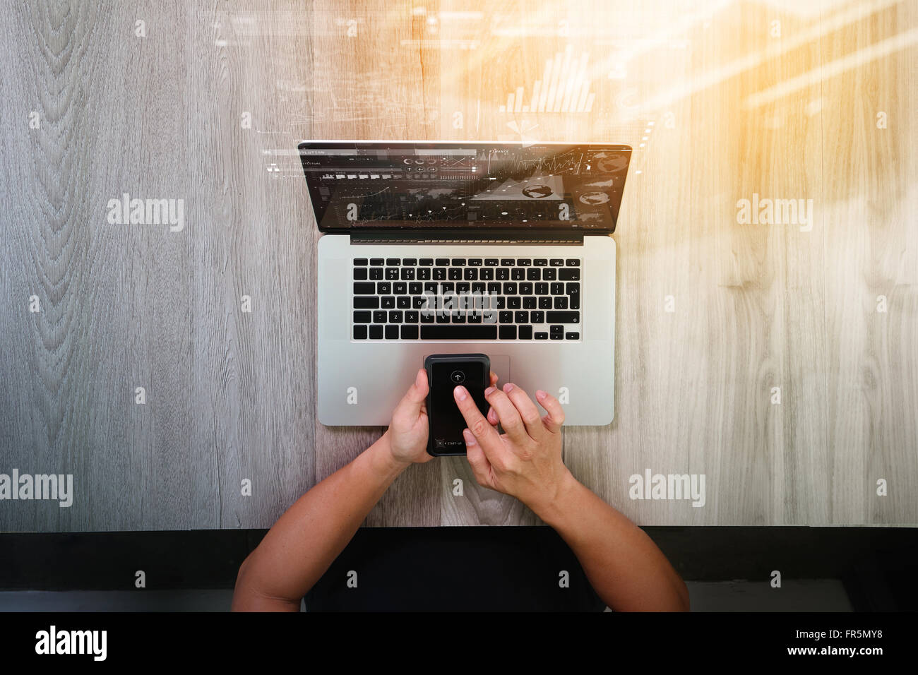 top view of Designer hand working with laptop computer and smarth phone ...