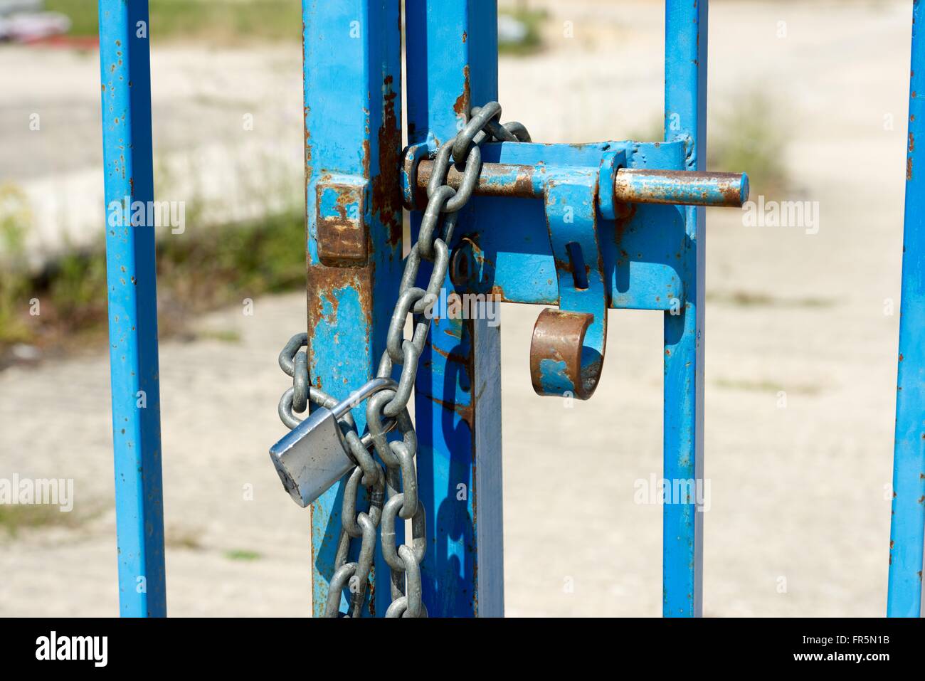 Door closed with a chain and padlock Stock Photo - Alamy