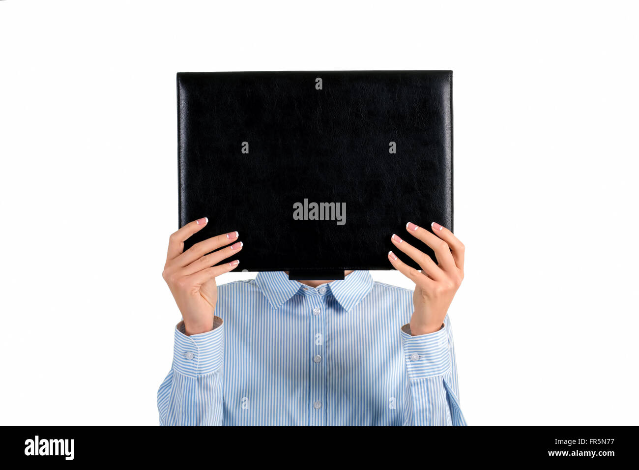 Lady's face covered with folder Stock Photo - Alamy