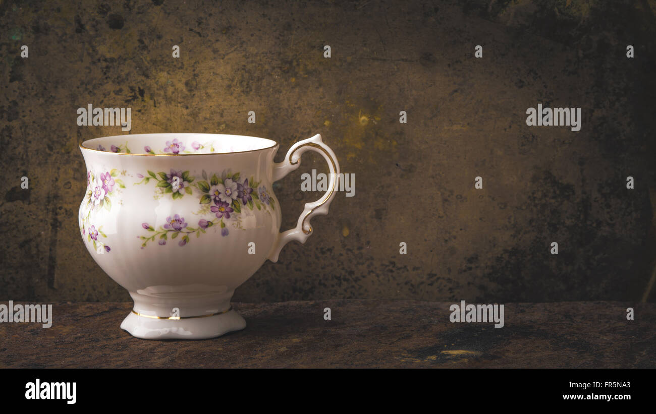 Old cup on metallic background horizontal Stock Photo - Alamy