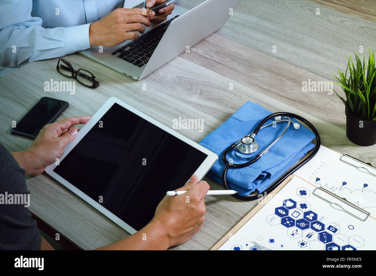 top view of Medicine doctor hand working with modern computer and ...