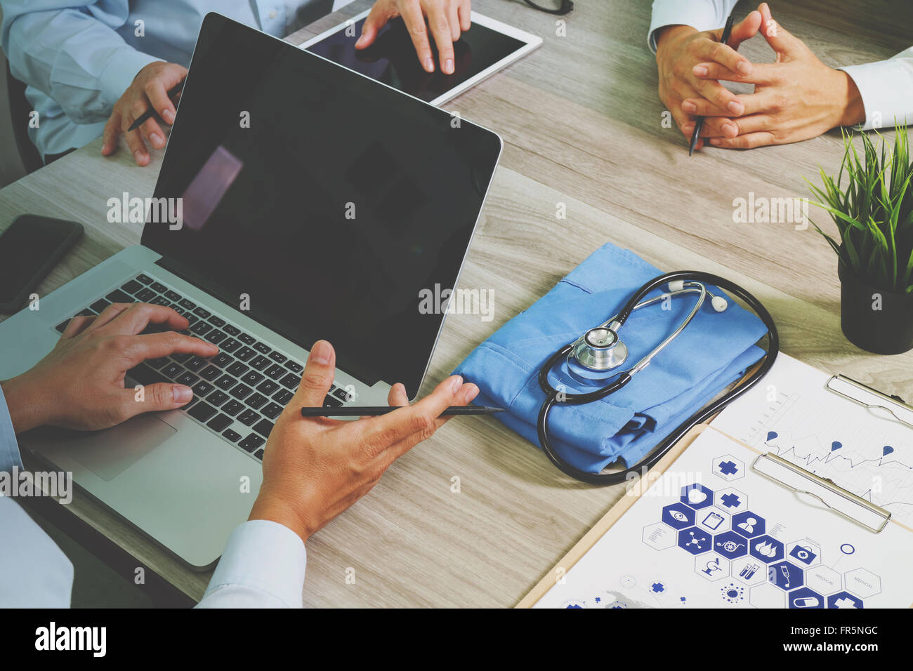 top view of Medicine doctor hand working with modern computer and ...