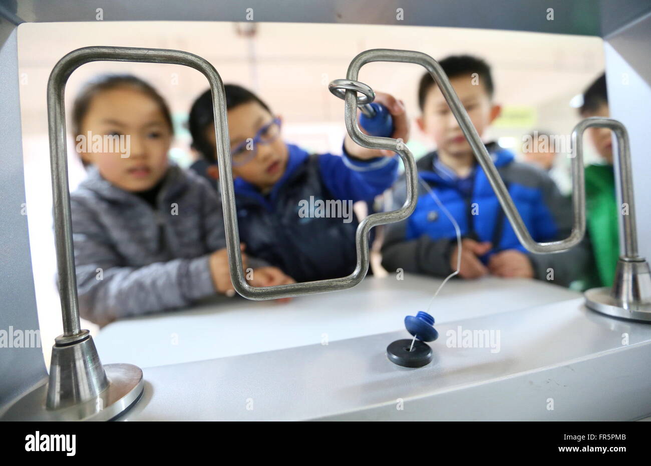 Jimo, China's Shandong Province. 21st Mar, 2016. Pupils experience a ...