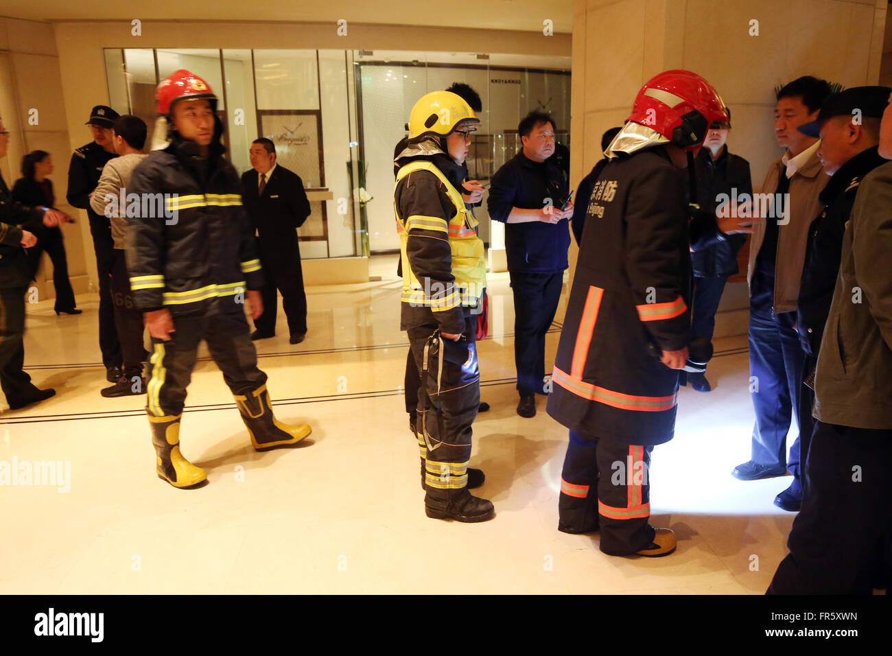 Beijing, China. 21st Mar, 2016. Fire fighters standing in the lobby of ...