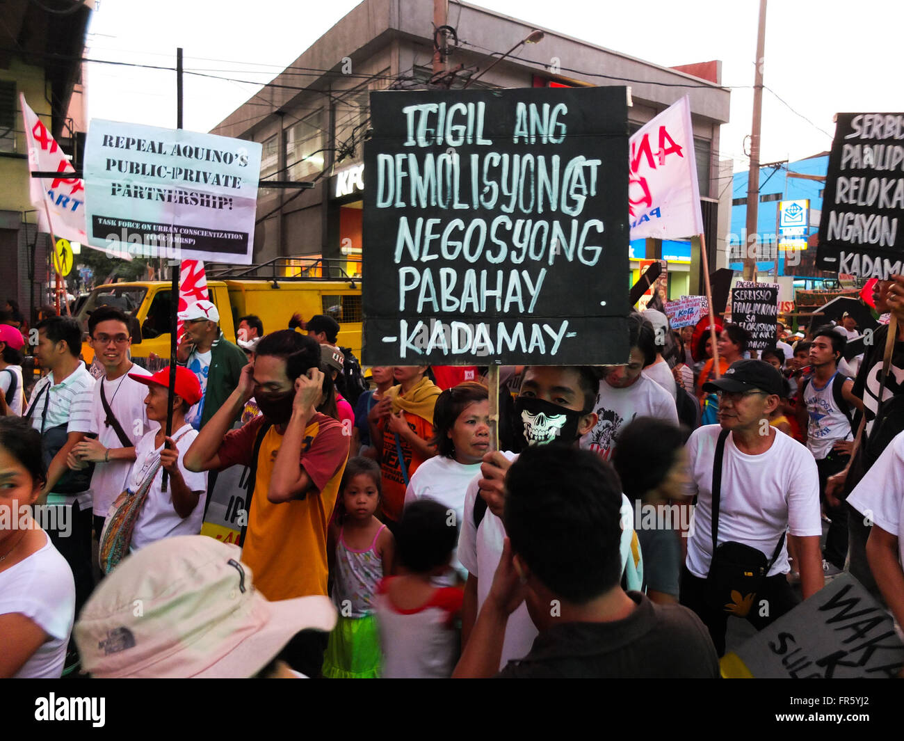 Urban poor groups holding placards, airing their grievances to the ...