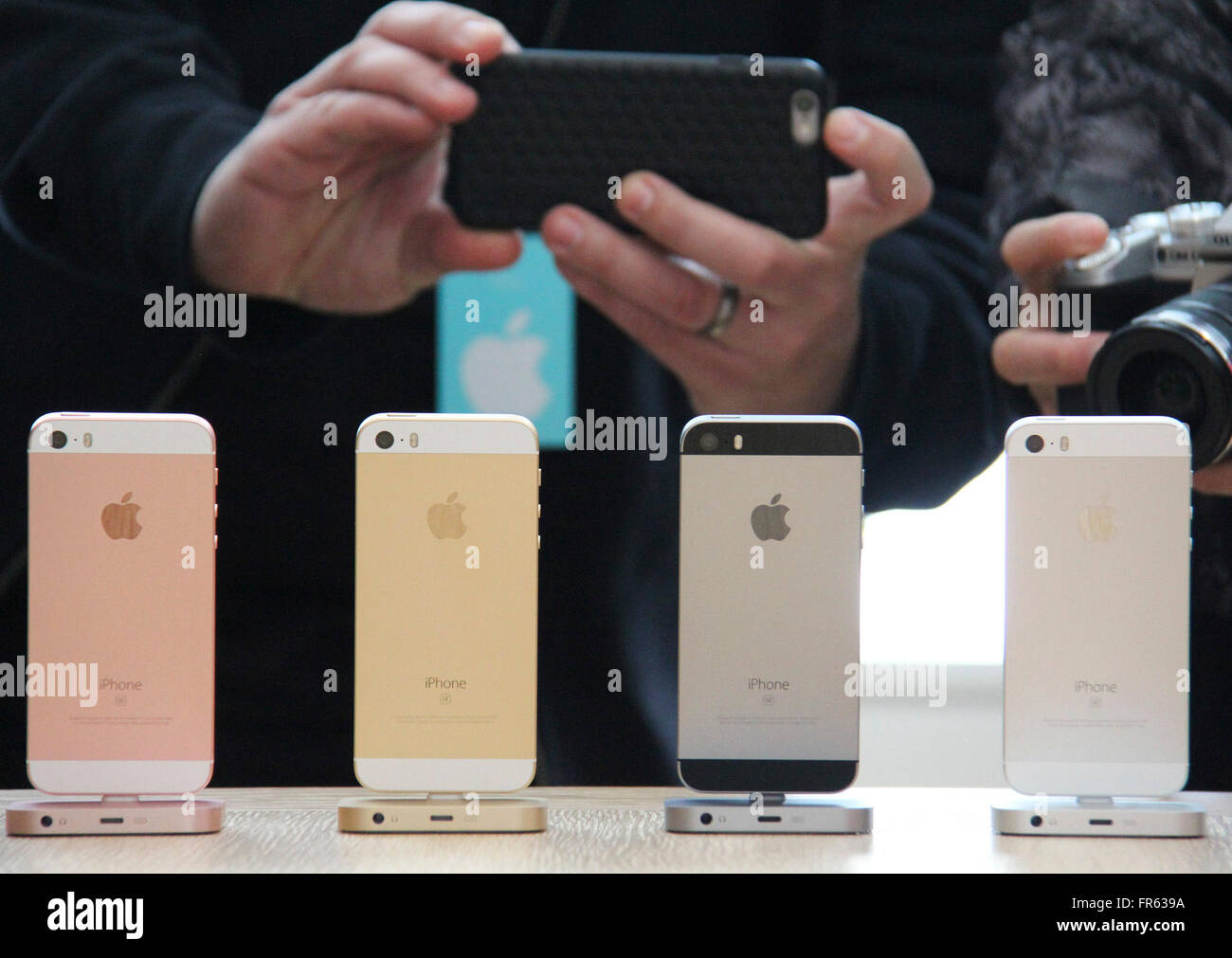 Cupertino. 21st Mar, 2016. Visitors take photos of the new iPhones ...