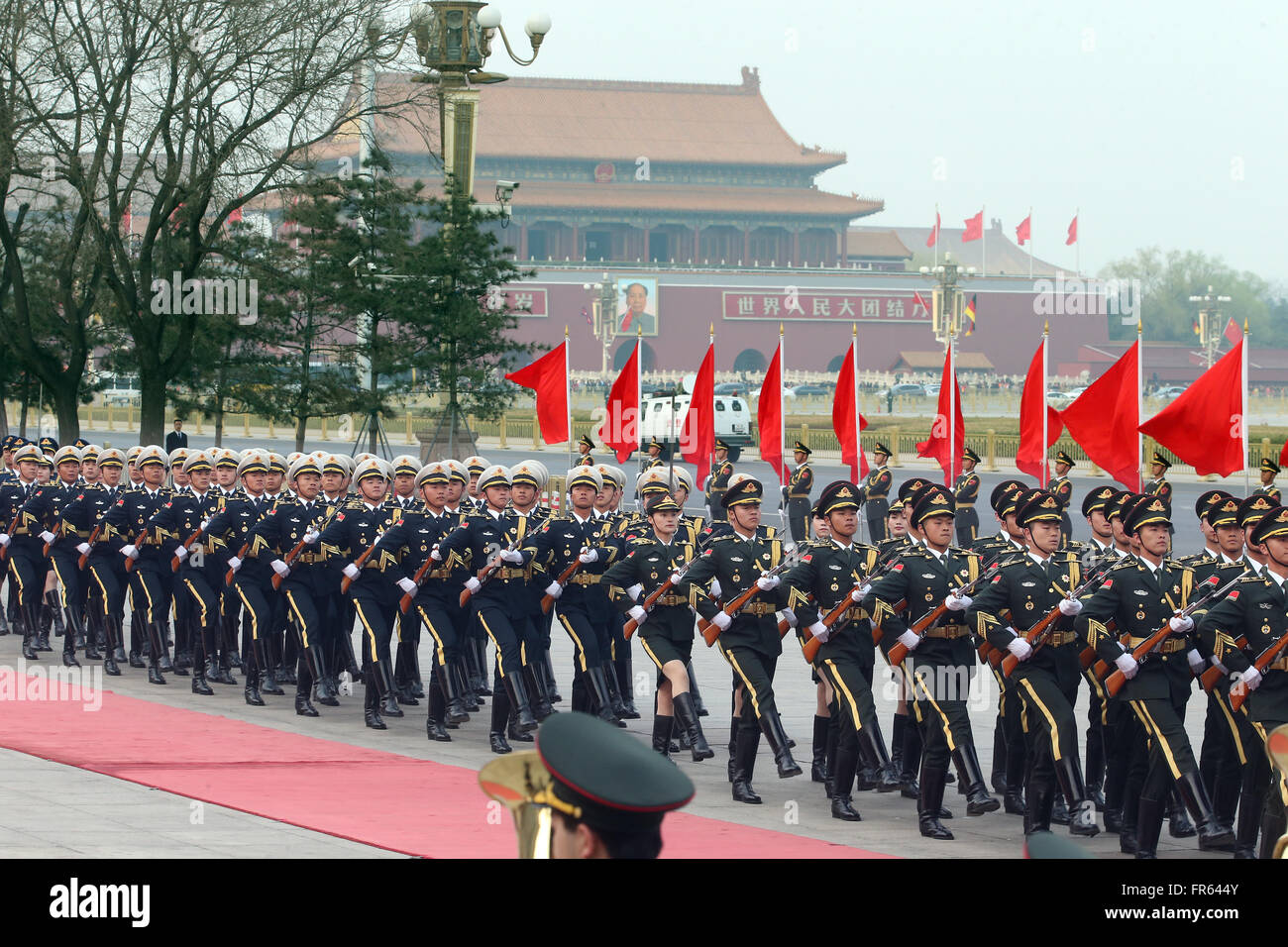 Soldiers marching in front of the Great Hall of the People in order to ...