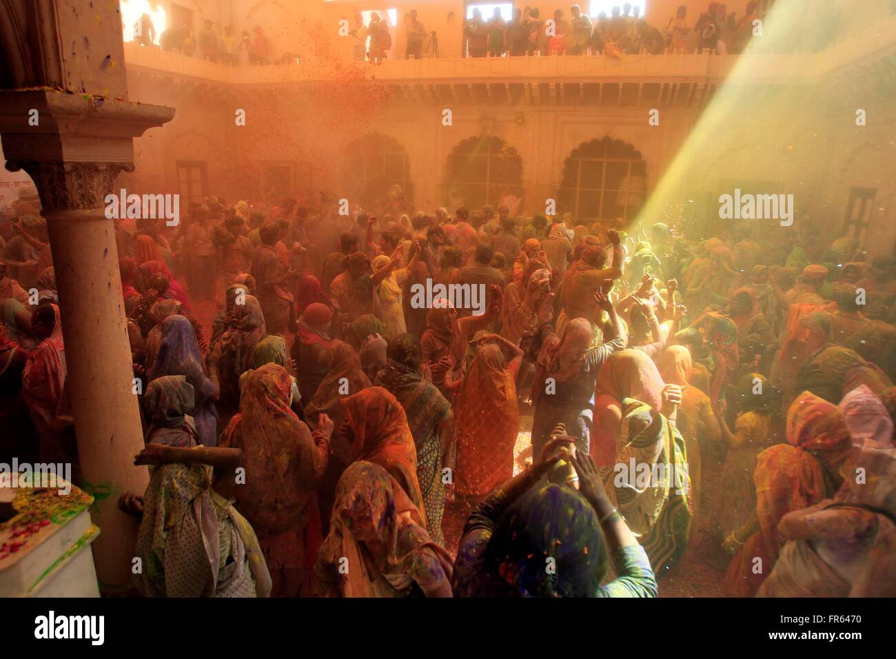 Mathura, India. 21st Mar, 2016. Devotees enjoy dancing and throwing of ...