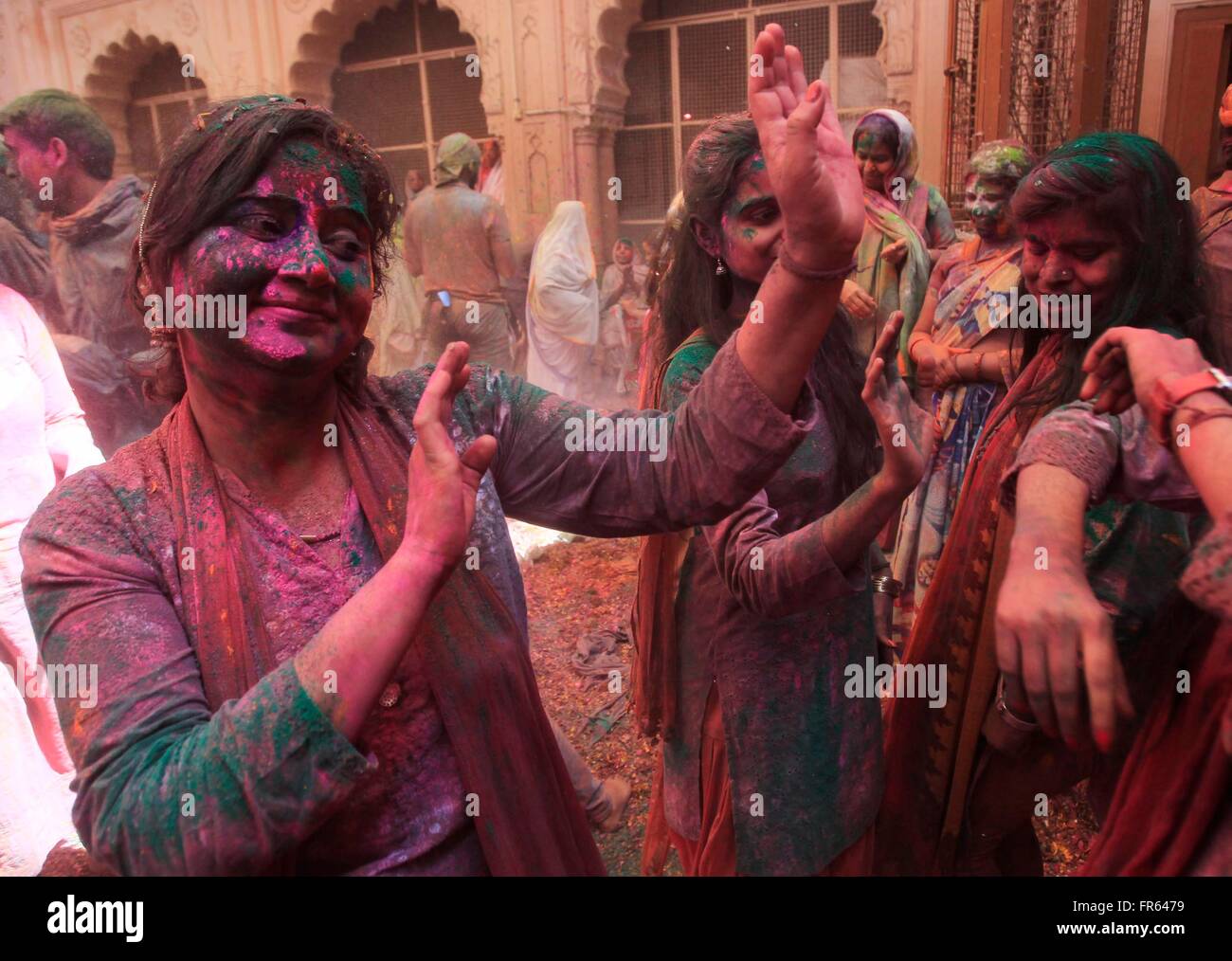 Mathura, India. 21st Mar, 2016. Devotees enjoy dancing and throwing of ...