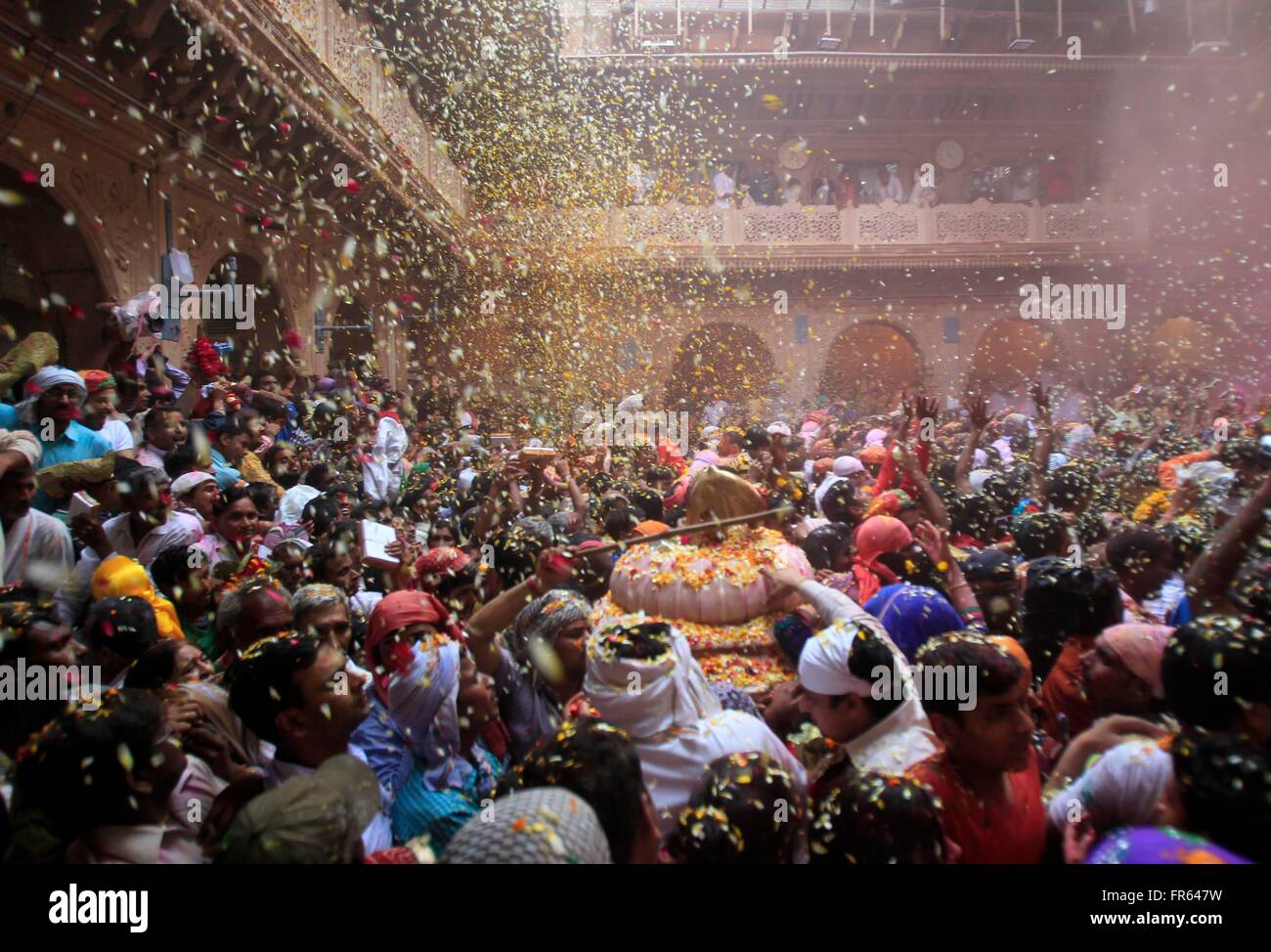 Mathura, India. 19th Mar, 2016. Devotees enjoy dancing and throwing of ...