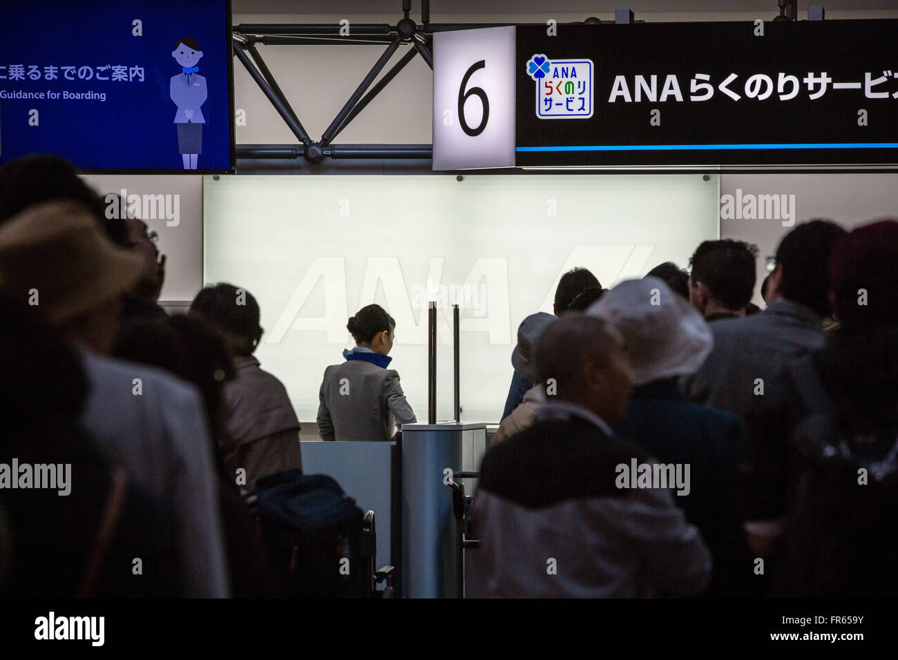Tokyo, Japan. 22nd Mar, 2016. A crowd of passengers queue in front of ...