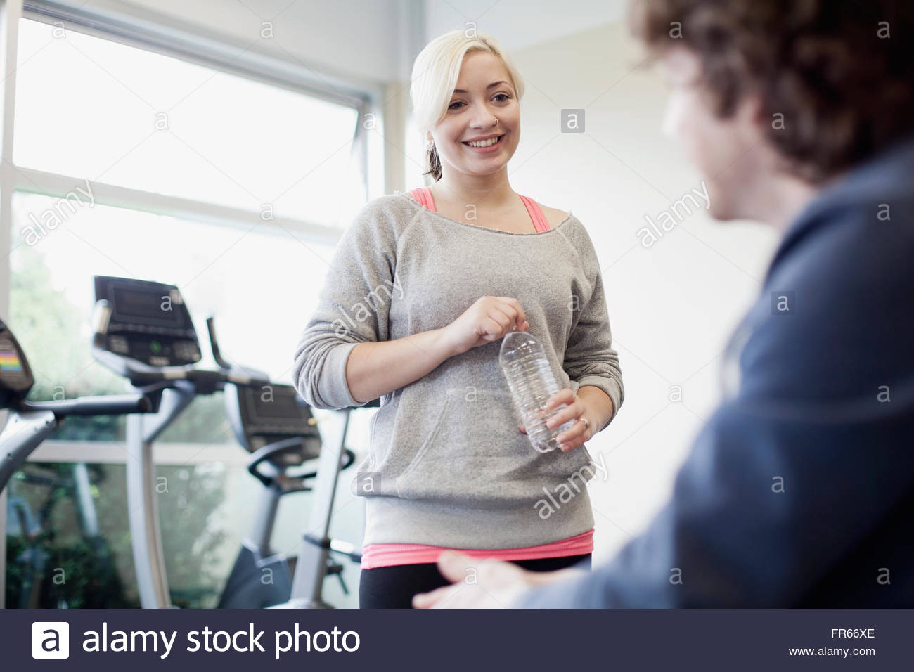 students talking at fitness center Stock Photo - Alamy