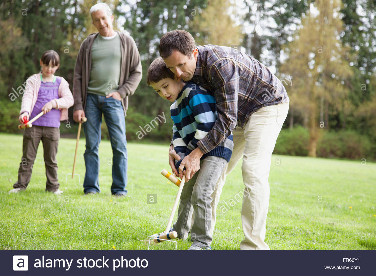 Family playing croquet hi-res stock photography and images - Alamy