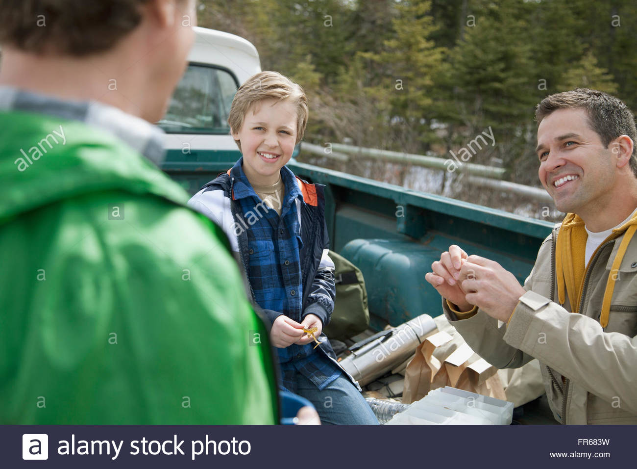 family of men prepping for fishing trip Stock Photo - Alamy