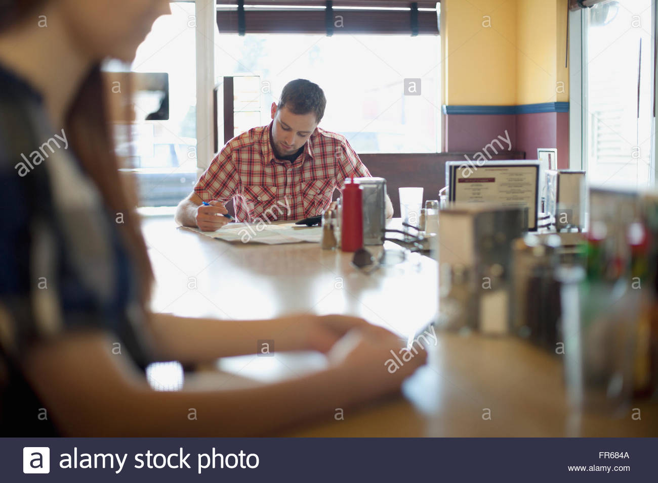 man reviewing map at restaurant Stock Photo - Alamy