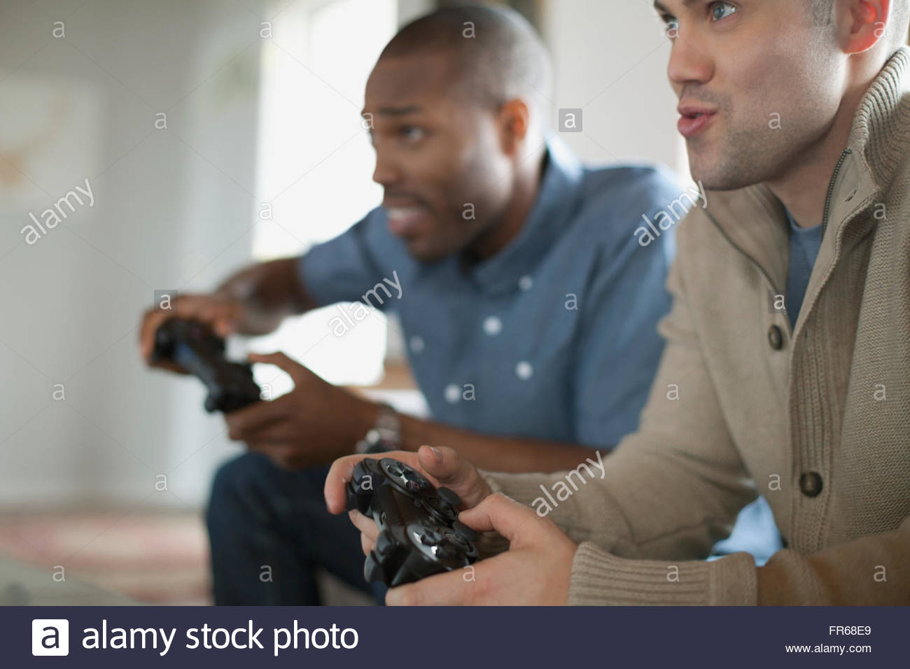mid-adult men gaming together Stock Photo - Alamy