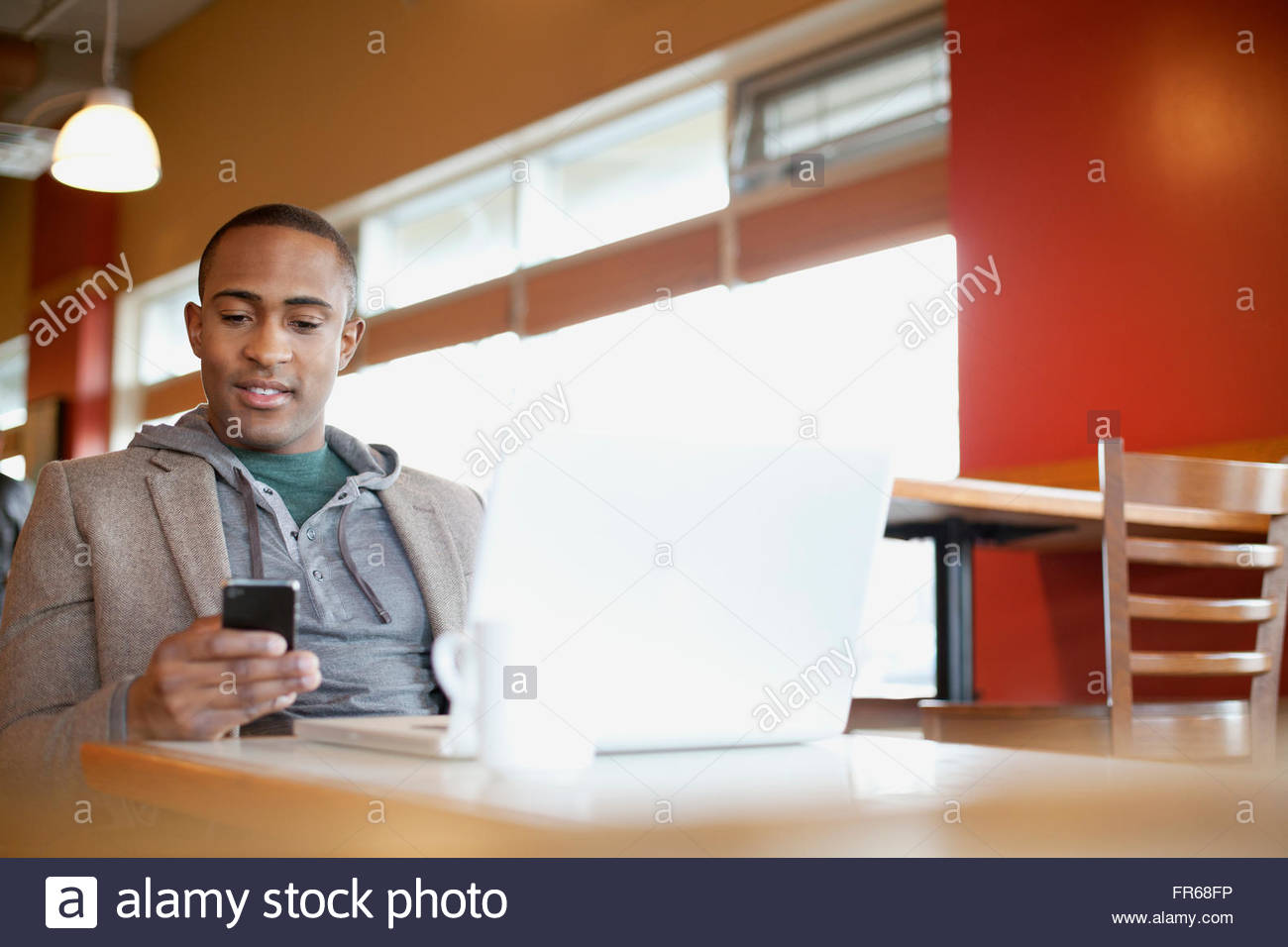 man using wi-fi technology at cafe Stock Photo - Alamy man using wi-fi technology at cafe Stock Photo - Alamy