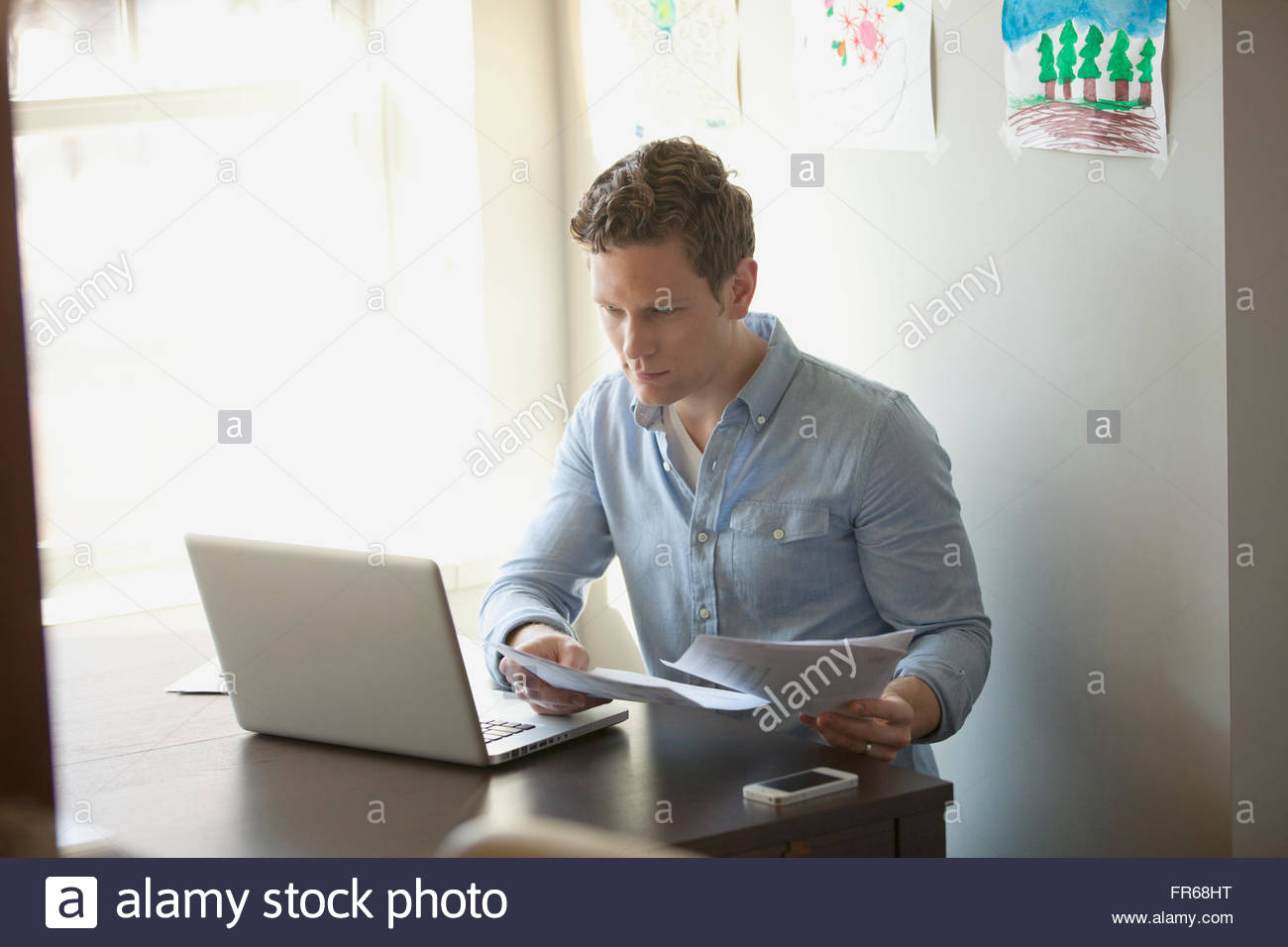 man working on laptop at home Stock Photo - Alamy