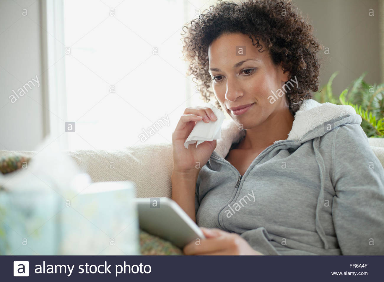 woman nursing a cold at home Stock Photo - Alamy