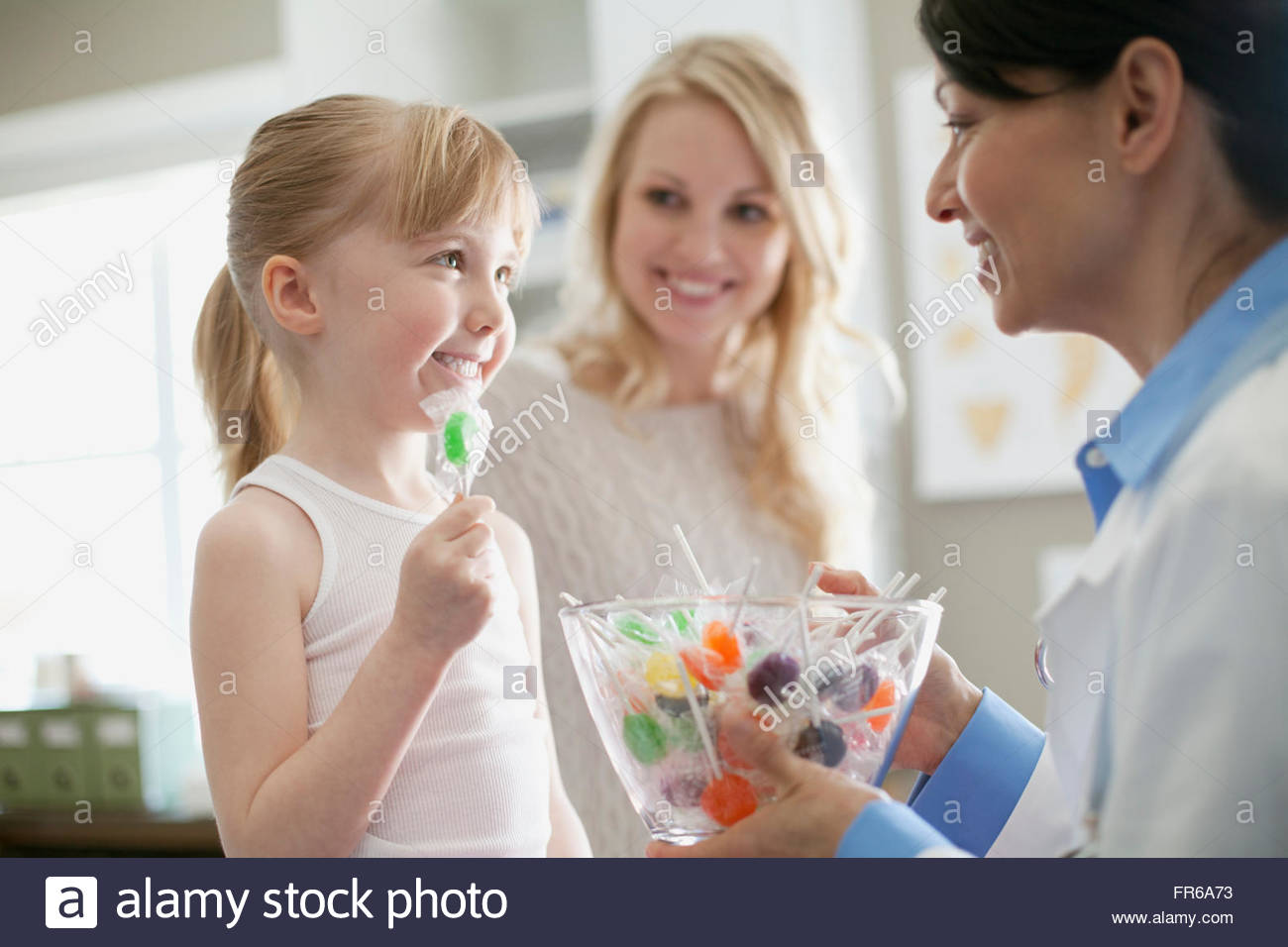 young patient accepting a lollipop Stock Photo - Alamy
