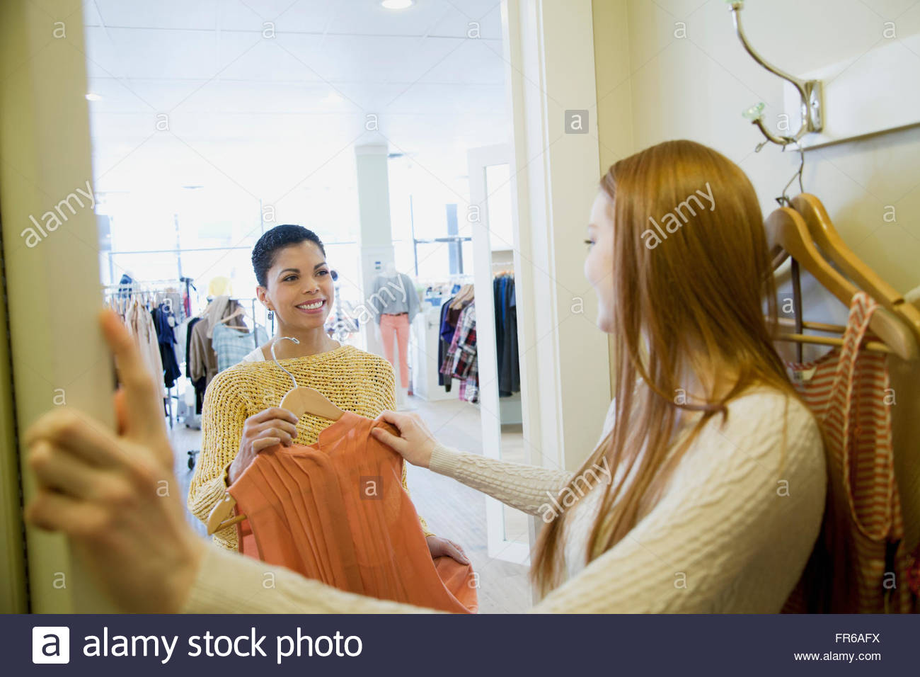 Young woman trying on clothes hi-res stock photography and images - Alamy