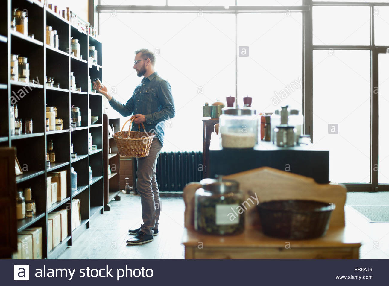 customer choosing spices in retail spice store Stock Photo - Alamy