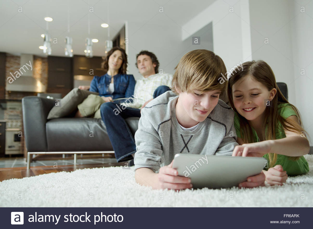 family enjoying movie night and technology together Stock Photo - Alamy family enjoying movie night and technology together Stock Photo - Alamy