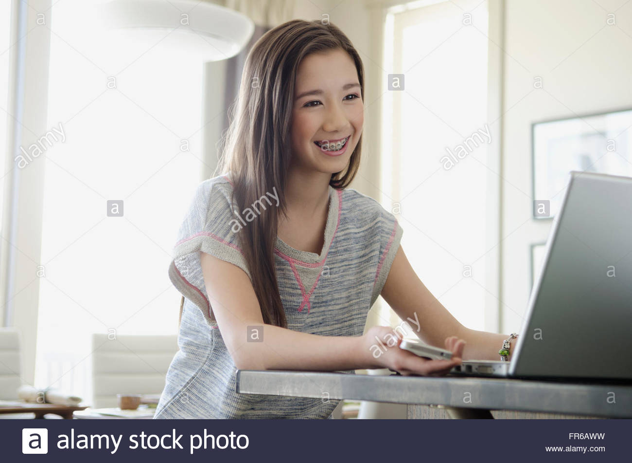 young girl on laptop Stock Photo - Alamy