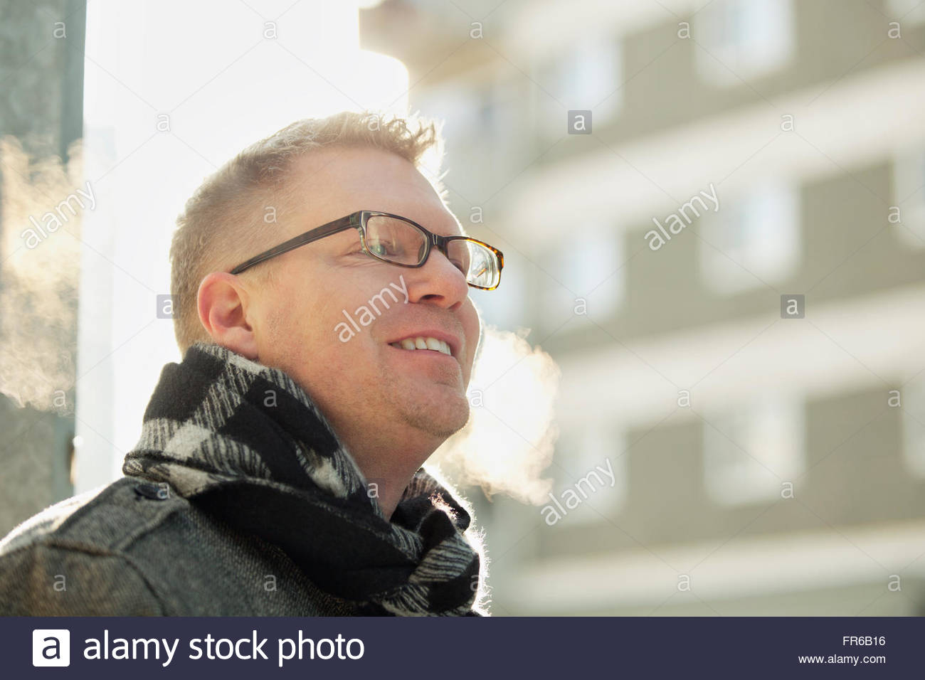 mid-adult man out for a brisk walk in the city Stock Photo - Alamy