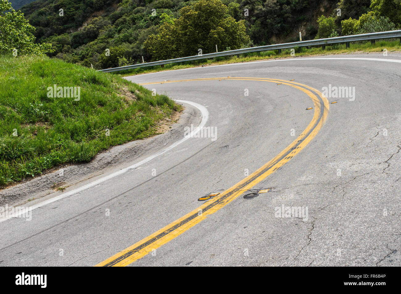 Road banks in a sharp bend in southern California mountains near Los ...