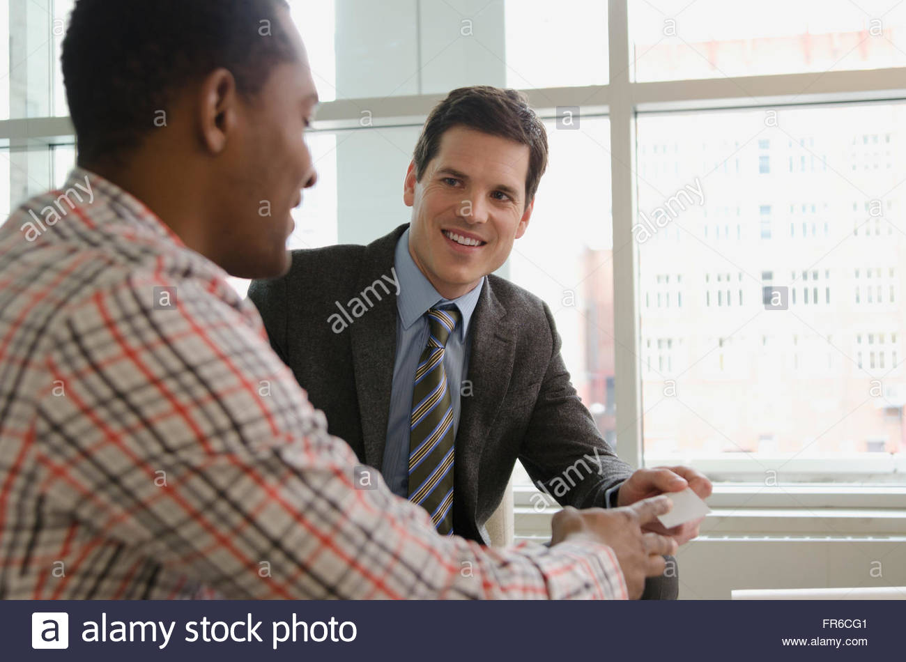 two people discussing business Stock Photo - Alamy
