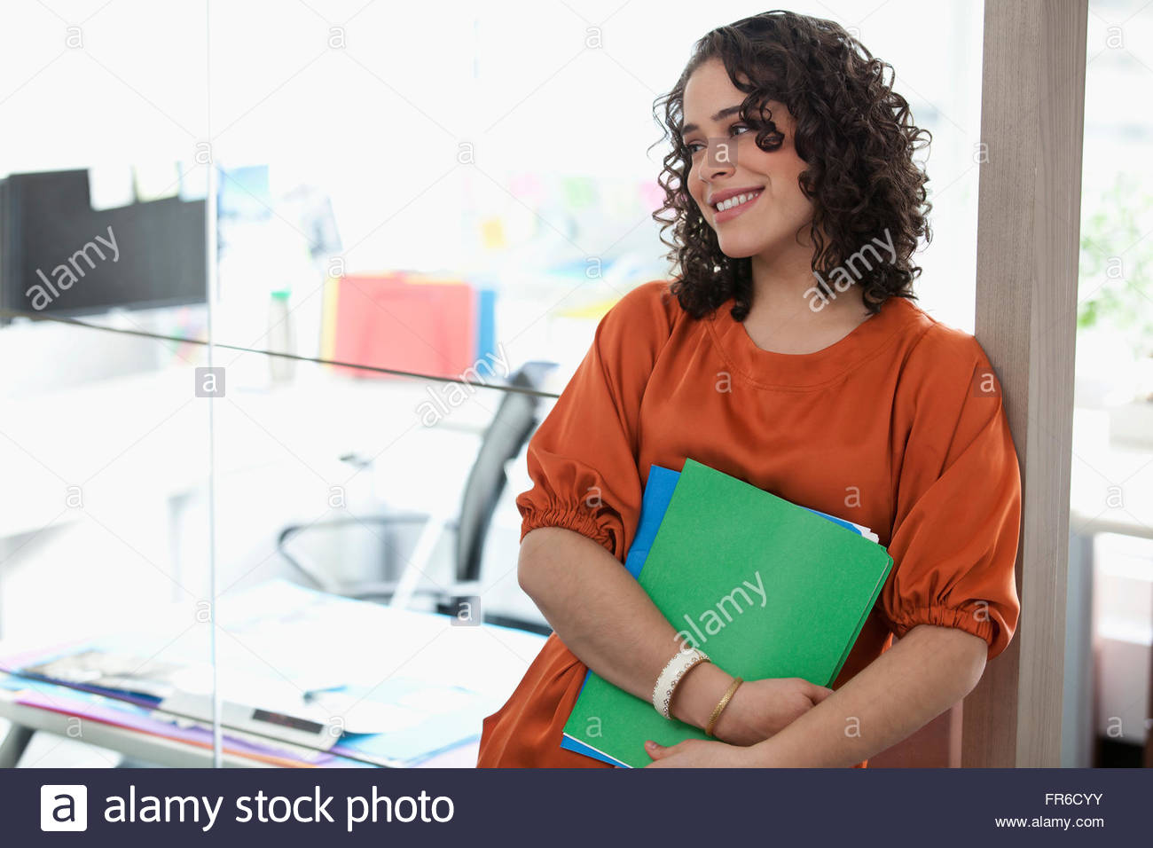 young office worker with file folders Stock Photo - Alamy
