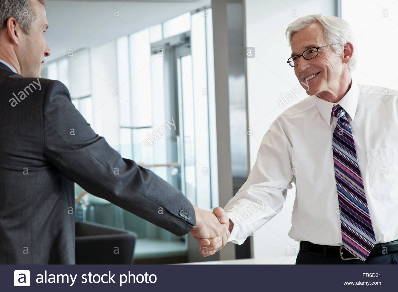 business men shaking hands Stock Photo - Alamy