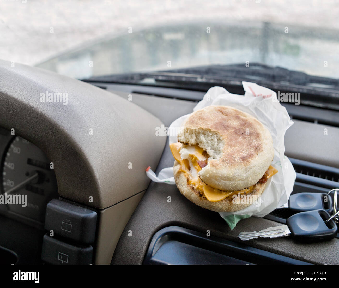 A bitten sandwich on a dashboard Stock Photo - Alamy