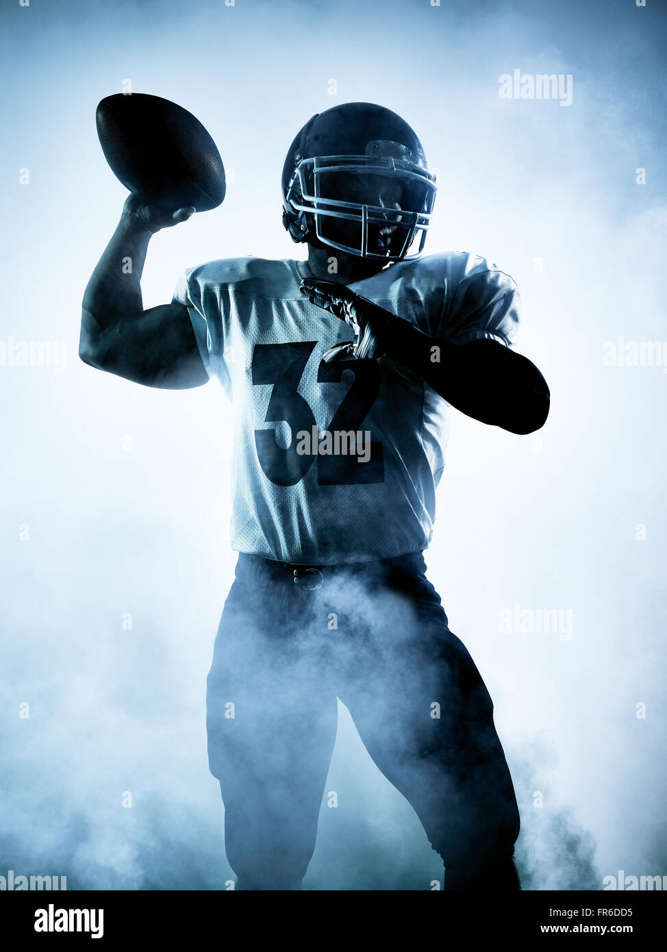 one american football player portrait in silhouette shadow on white ...