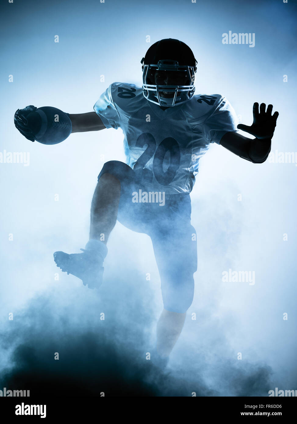 one american football player portrait in silhouette shadow on white ...