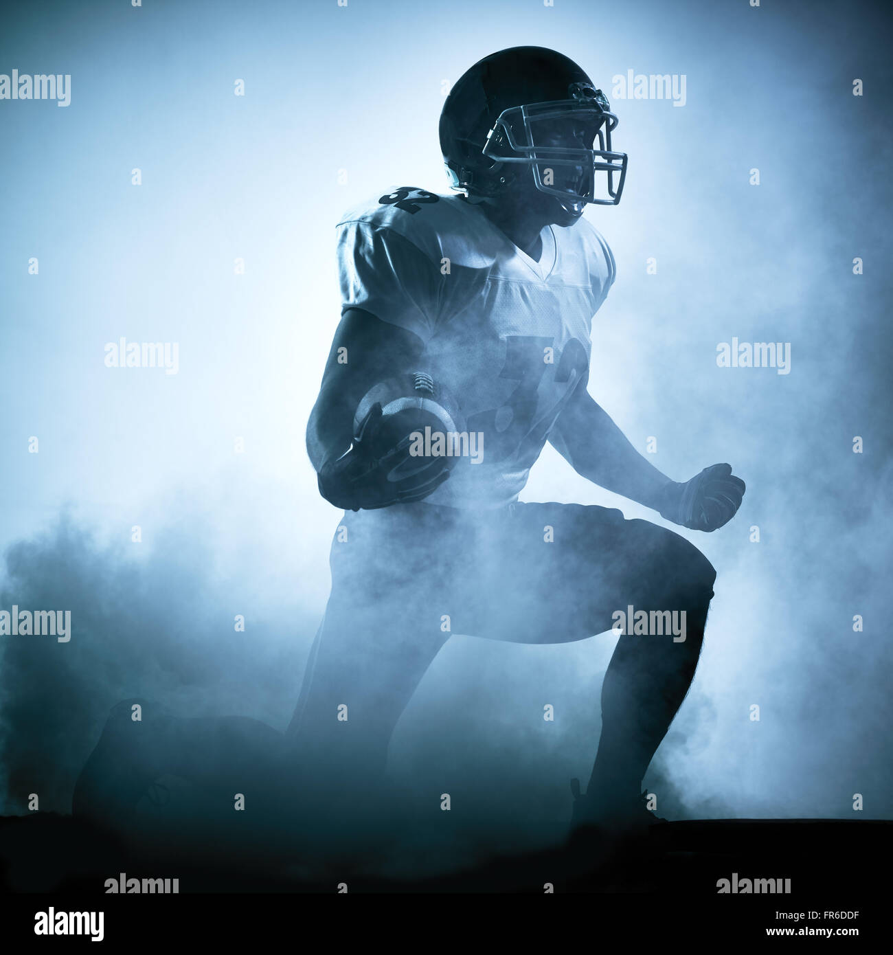 one american football player portrait in silhouette shadow on white ...